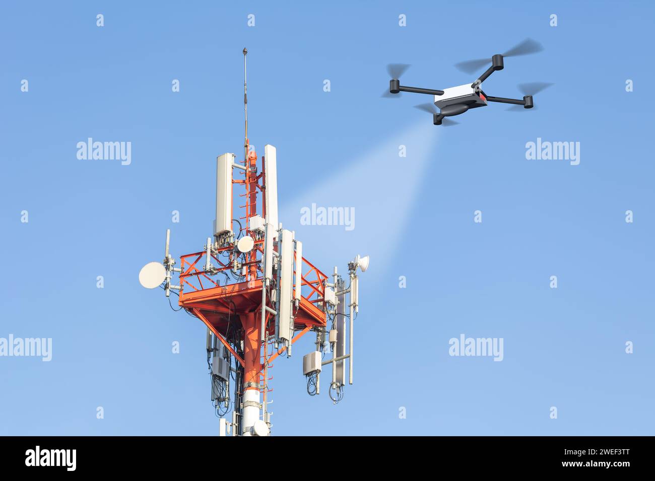 drone inspecting mobile network tower Stock Photo - Alamy