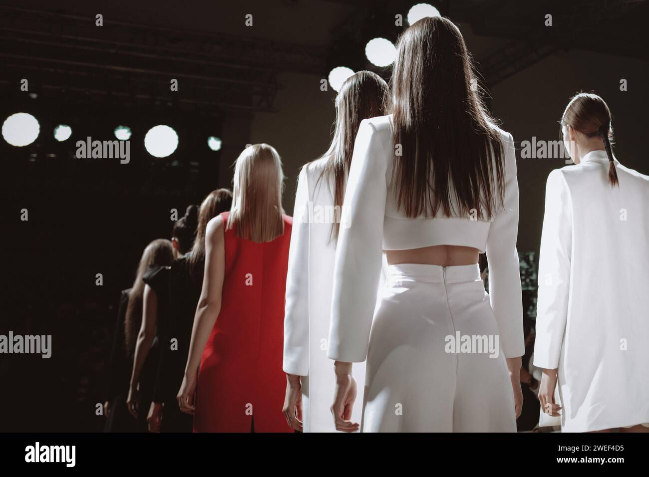 Fashion models wearing classy white red black outfits walking the ...