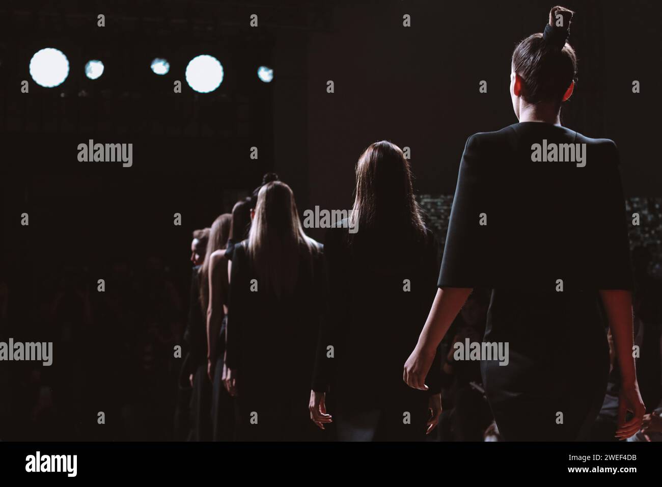 Fashion models wearing classy black outfits walking the runway finale ...