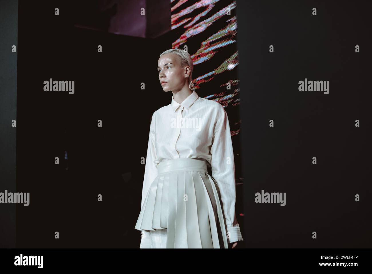 Fashion model wearing classy white outfit walking the runway during ...