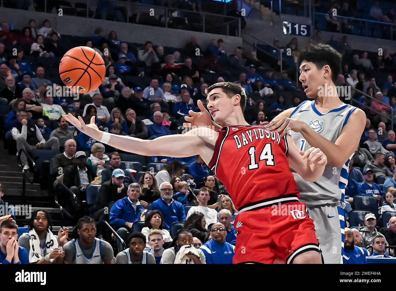 JANUARY 24, 2024: Davidson Wildcats guard Angelo Brizzi (14) reaches ...