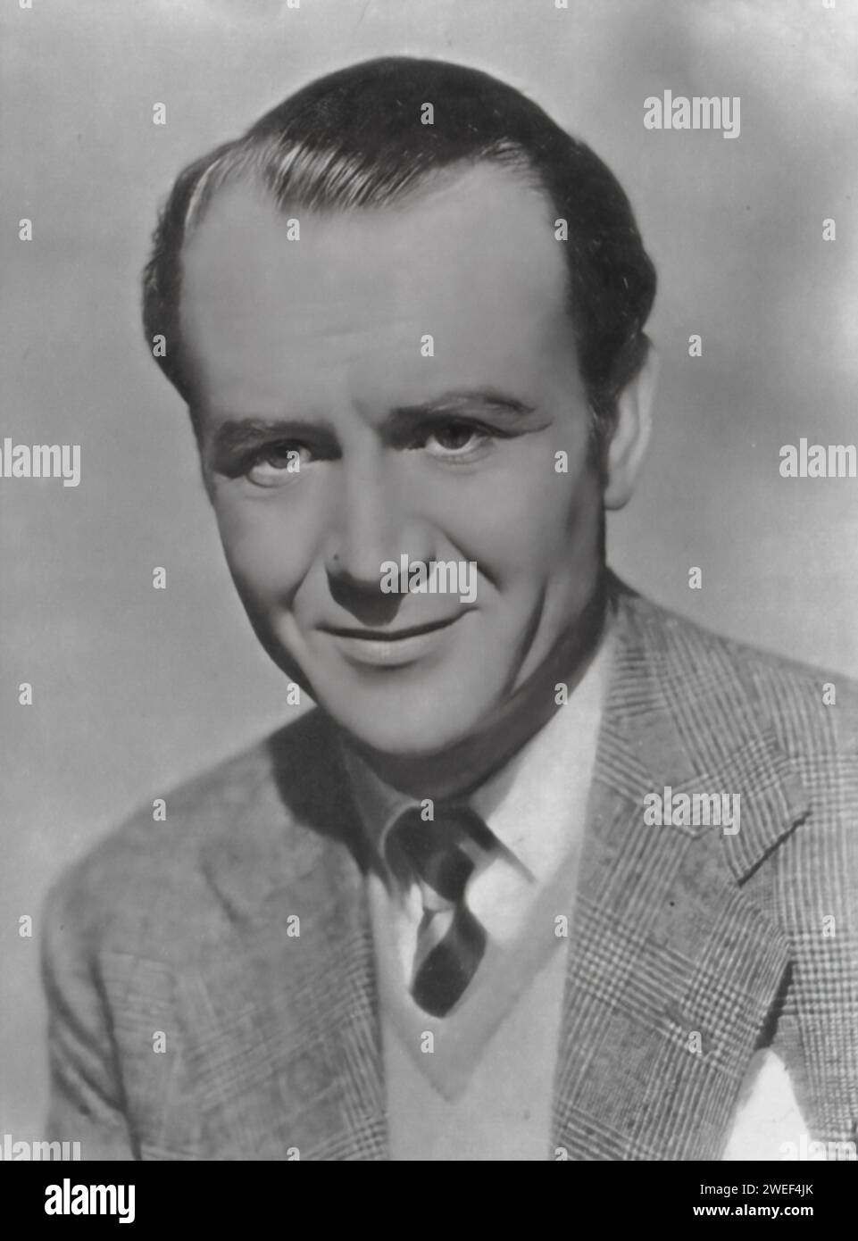 A portrait of John Mills, star of the film 'We Dive at Dawn' (1943). In ...