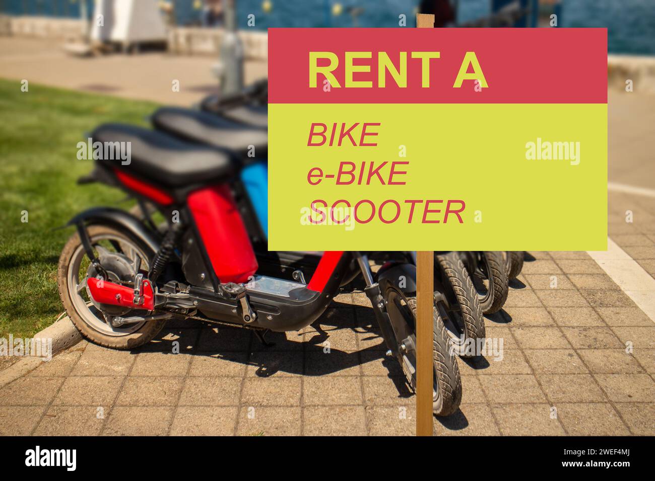 sign for renting a bike, e-bike, scooter Stock Photo - Alamy