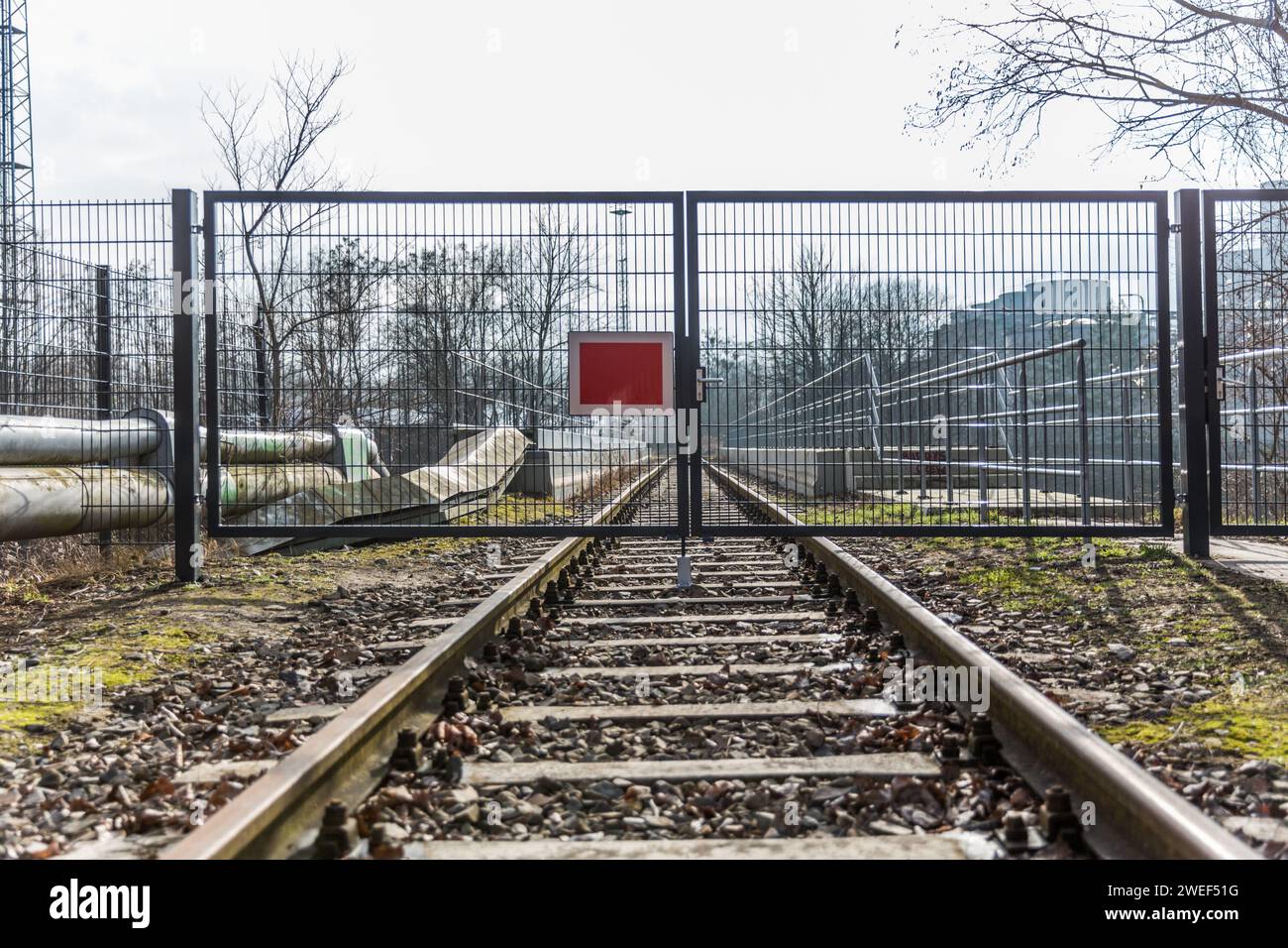 Gated rail entrance to Rudersdorf chemical plant, near Berlin, Germany ...