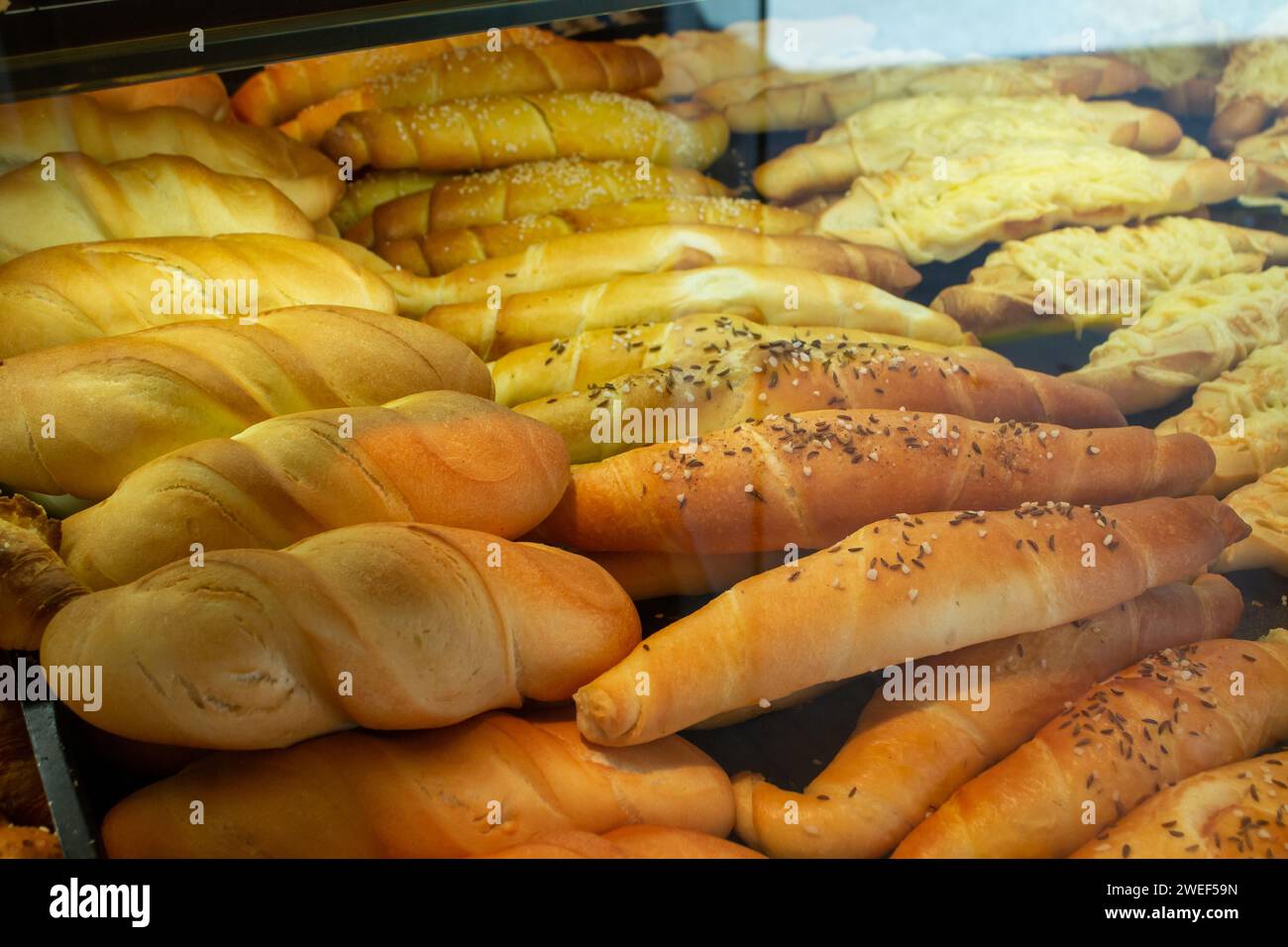 types of bread displayed in bakery shelf Stock Photo - Alamy