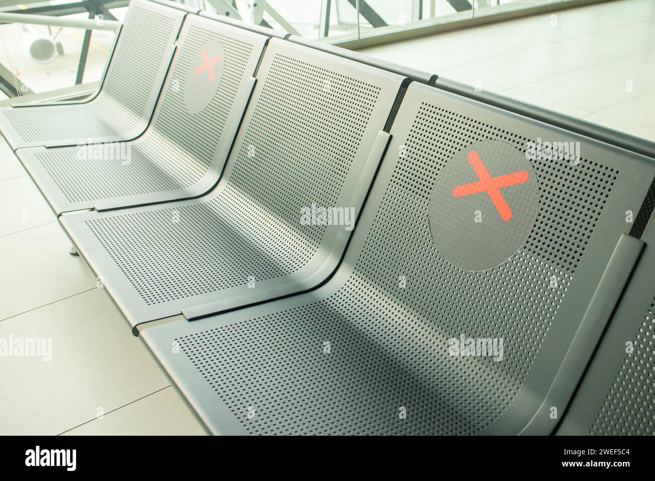 airport seats separation sign during covid-19 epidemic Stock Photo - Alamy