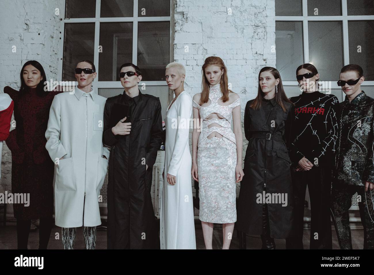 Fashion models in modern designer outfits posing on the backstage ...