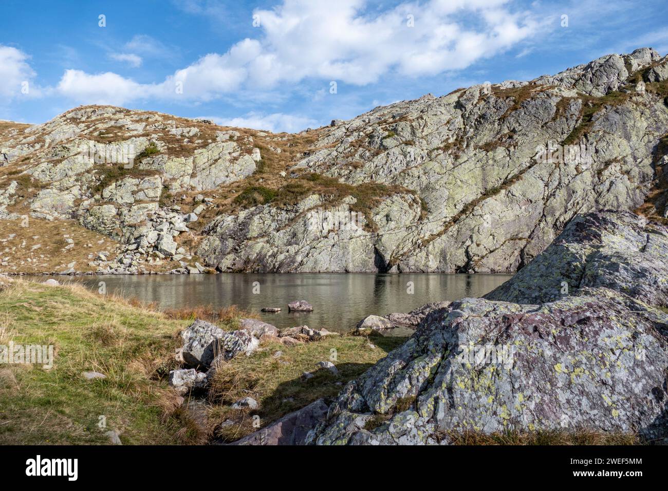 A scenic lake nestled amidst majestic mountain ranges Stock Photo - Alamy