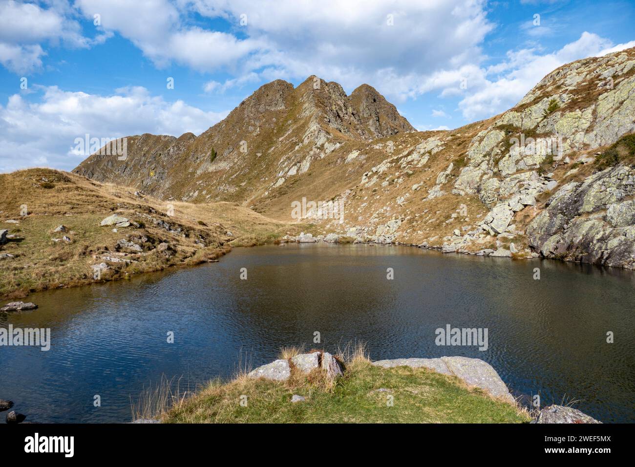 A scenic lake nestled amidst majestic mountain ranges Stock Photo - Alamy