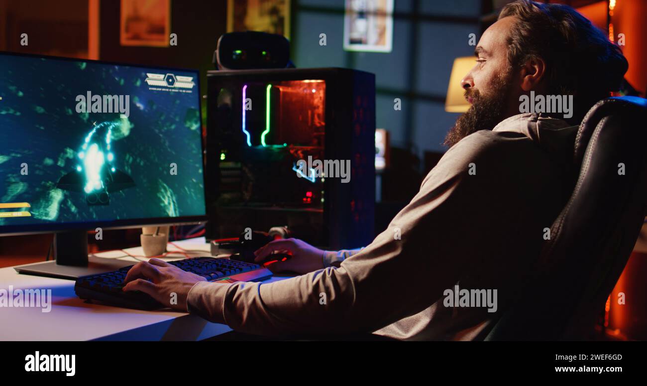 Man In Neon Lit Apartment Having Fun And Laughing While Playing