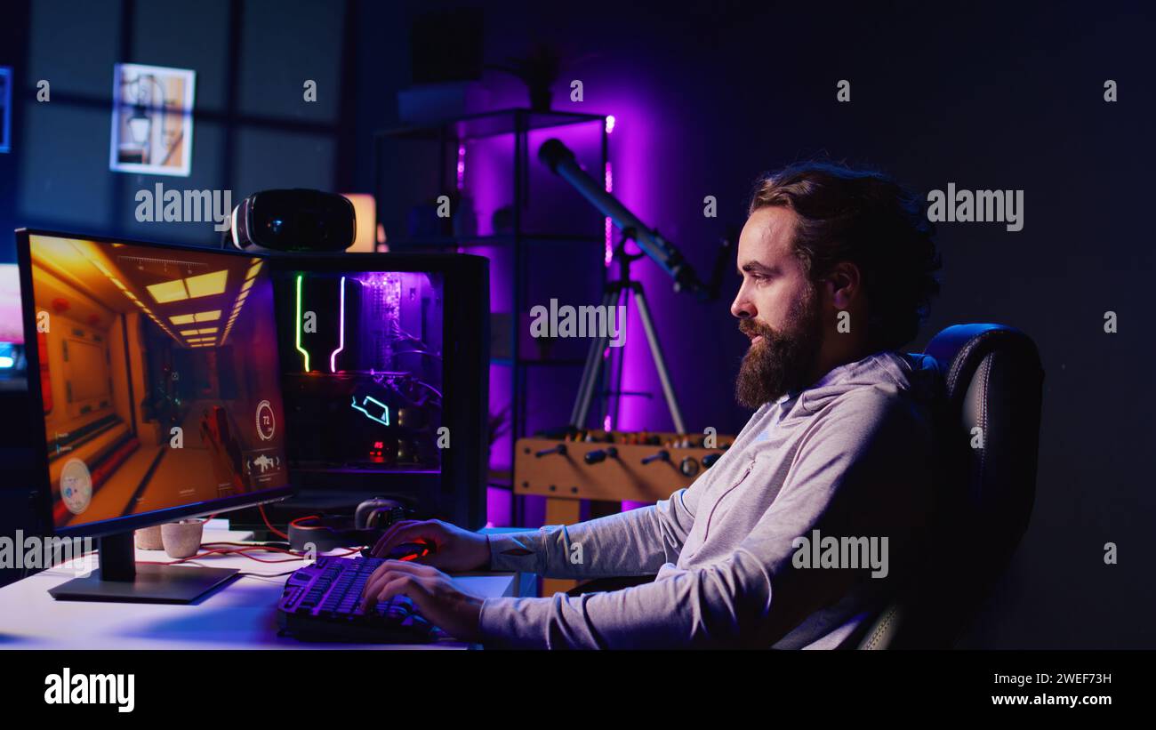 Pro gamer competing in intense online multiplayer videogame, shooting ...