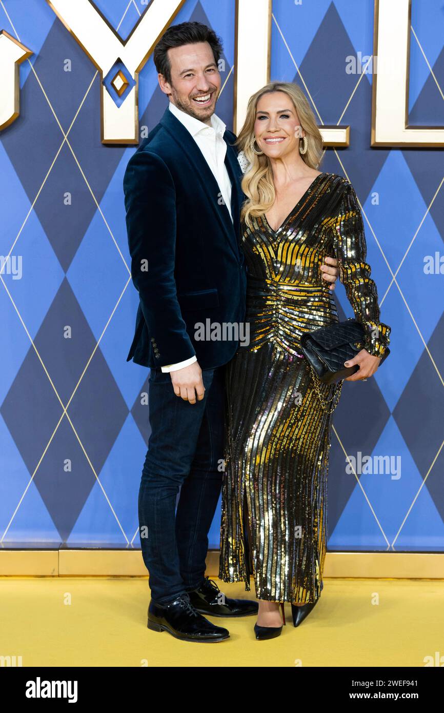 Alex Partakis, left, and Heidi Range pose for photographers upon ...