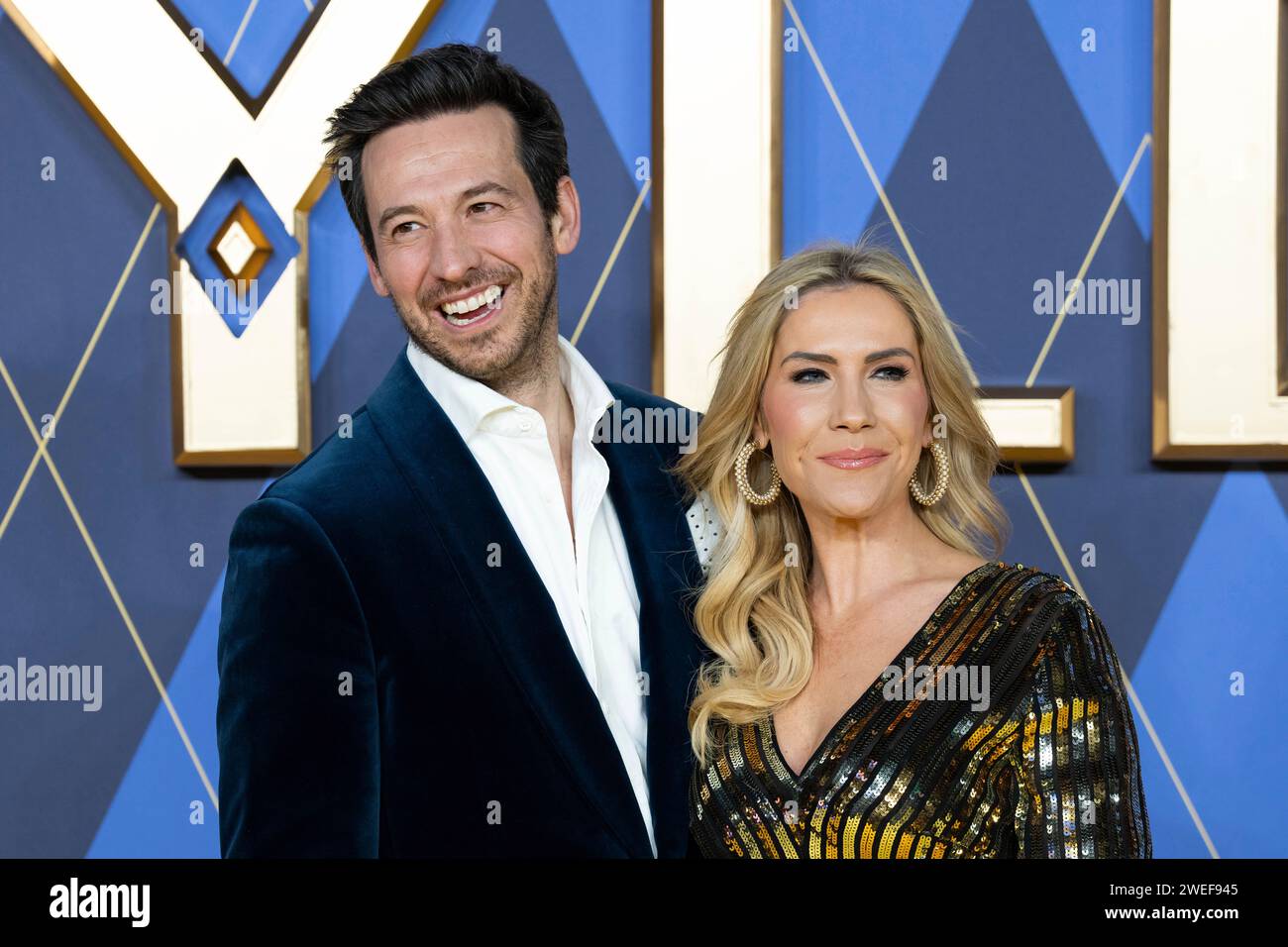 Alex Partakis, left, and Heidi Range pose for photographers upon ...