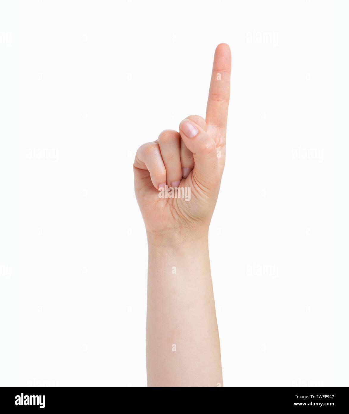 Close-up of woman hand showing forefinger up with white background ...