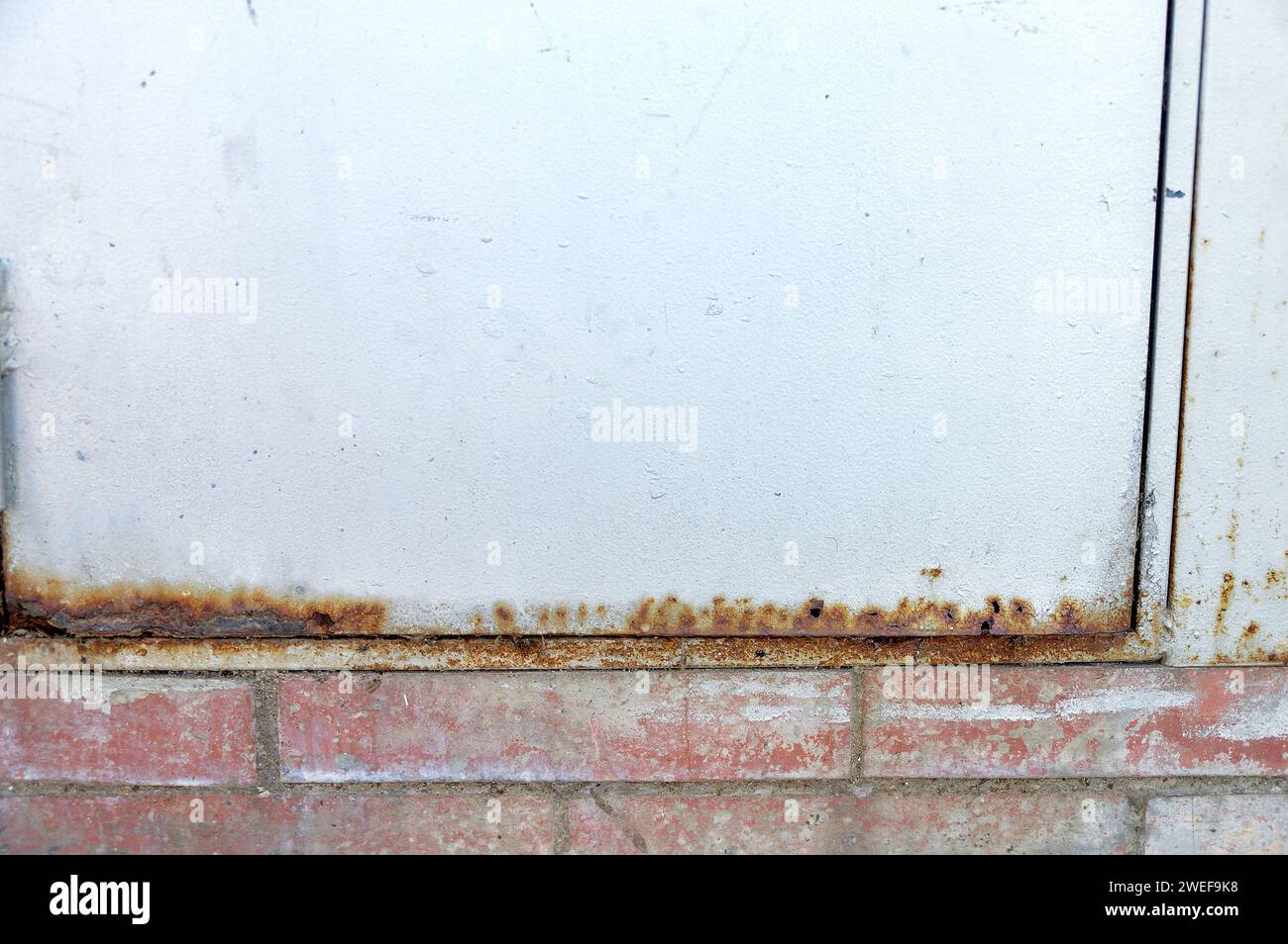 Metal door rusted by moisture and rain Stock Photo - Alamy