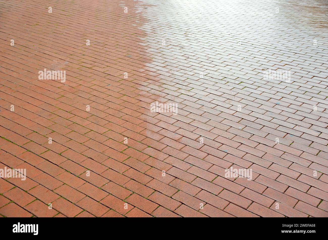 Close-up of humity on the floor of street. Wet floor from rainy .Danger ...