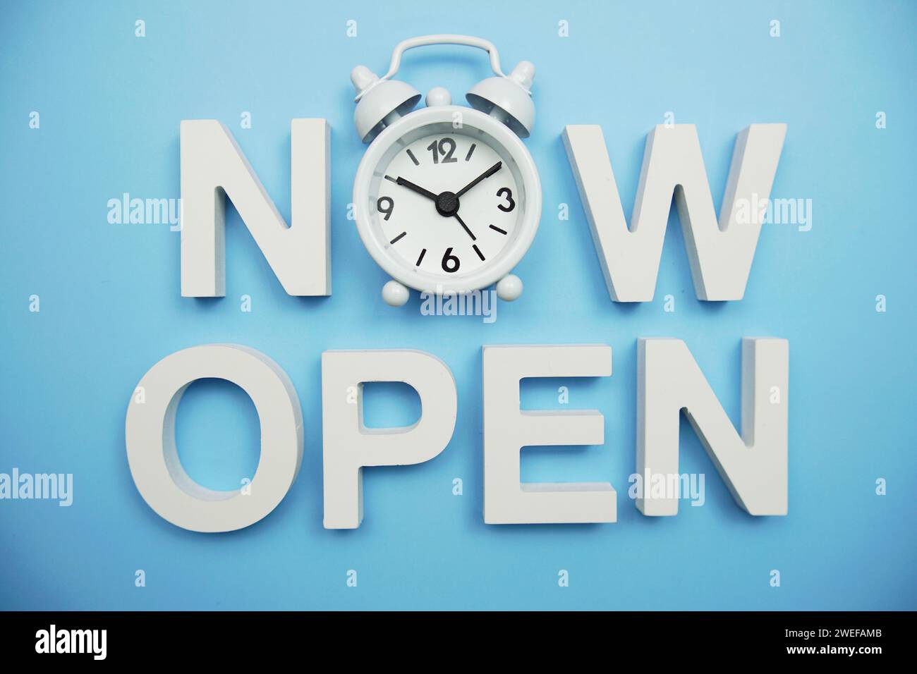 Now Open alphabet letters on blue background Stock Photo - Alamy