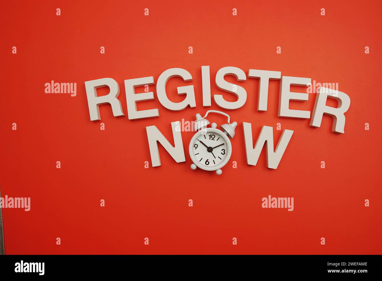 Register Now alphabet letters on red background Stock Photo - Alamy