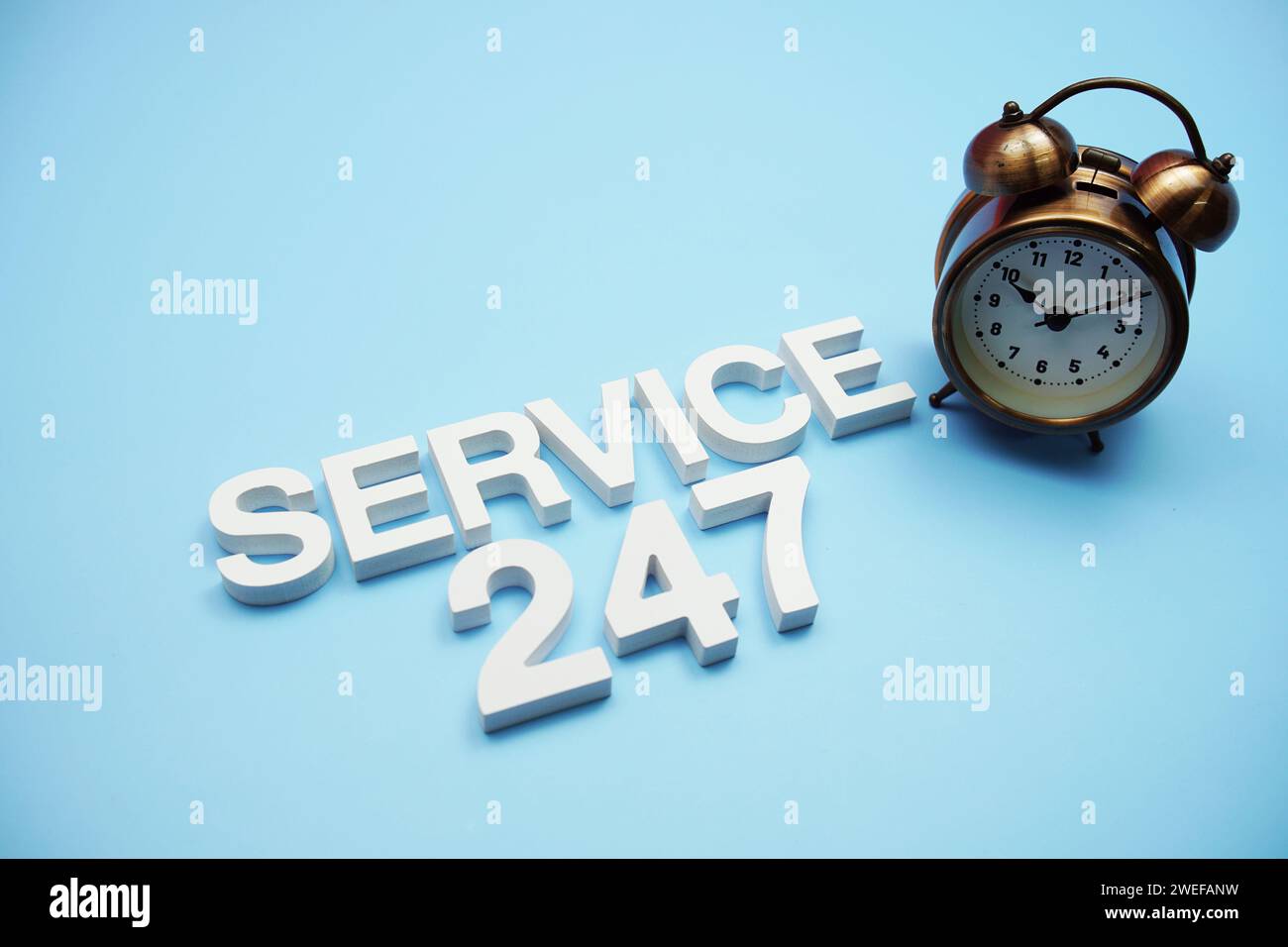 24/7 Service alphabet letters on blue background Stock Photo - Alamy