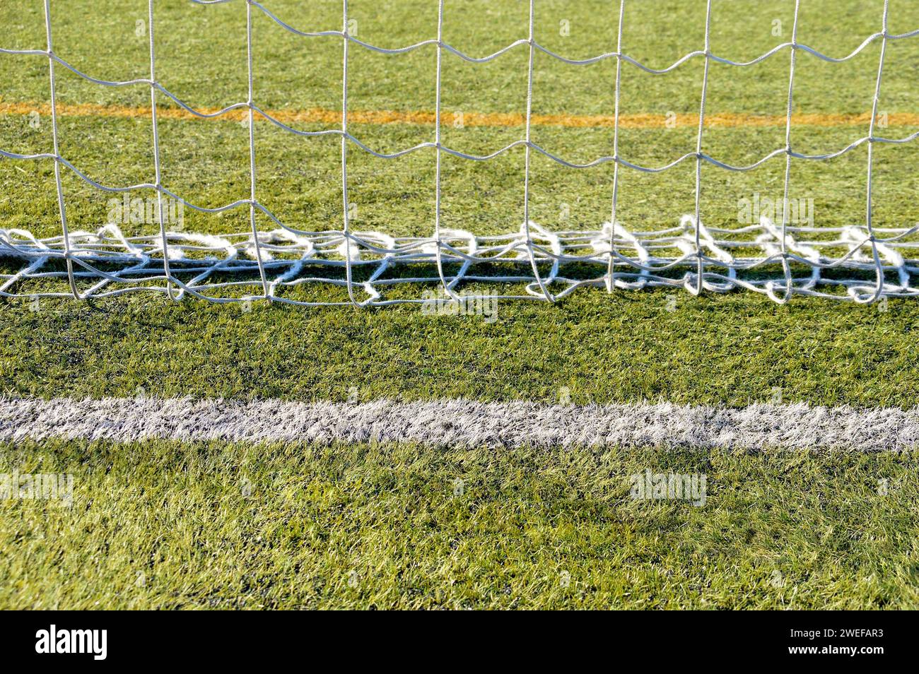 Soccer or football net background, view from behind the goal with focus ...