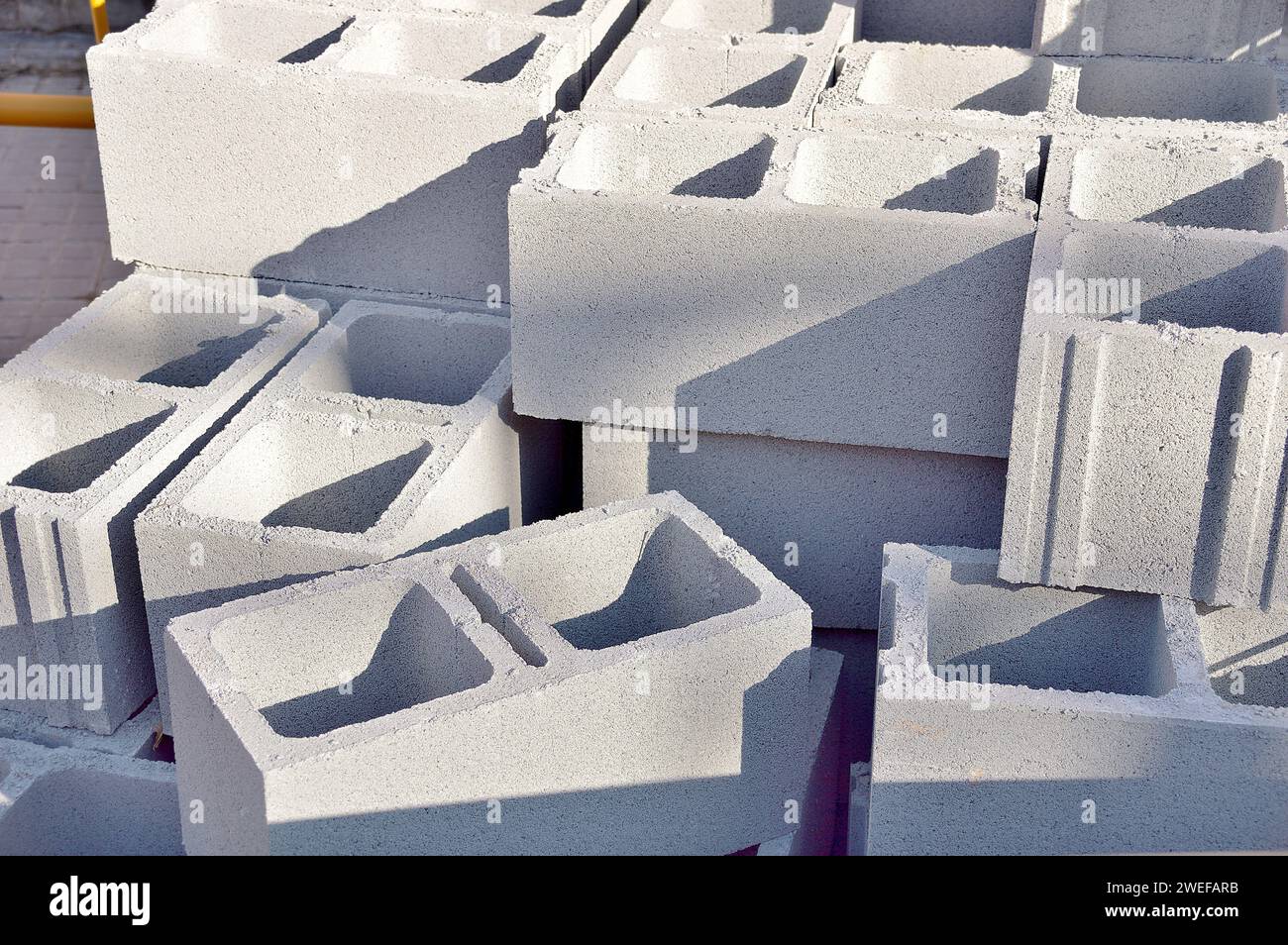 Pile of white bricks at a construction site building material concepts ...