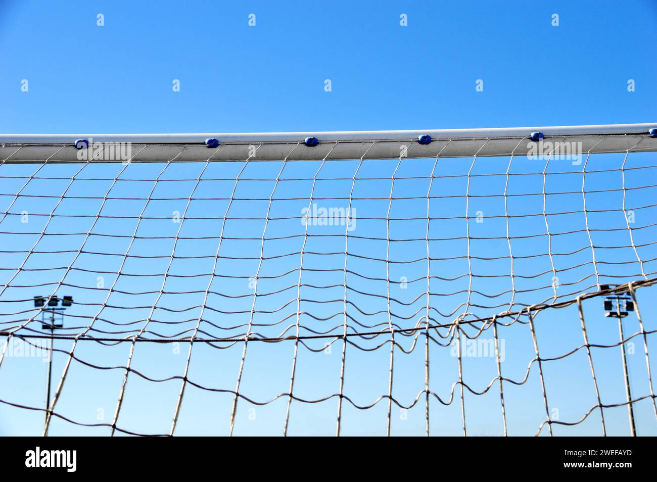 Soccer or football net background, view from behind the goal with blue ...