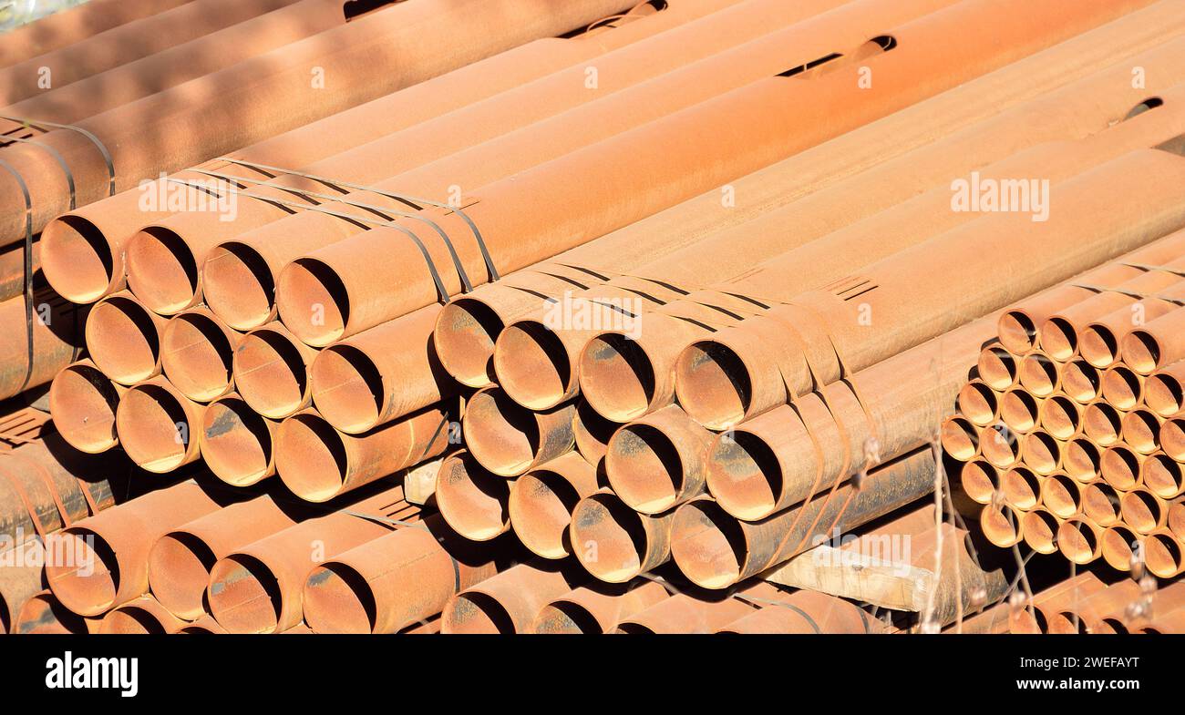 Stacked iron pipe abstract Stock Photo - Alamy