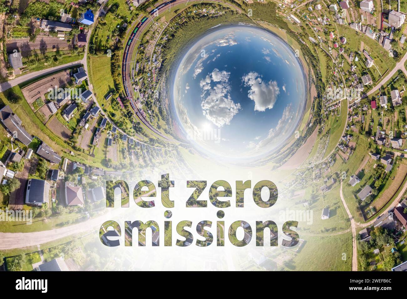 net zero emissions text concept image against blue little planet in ...