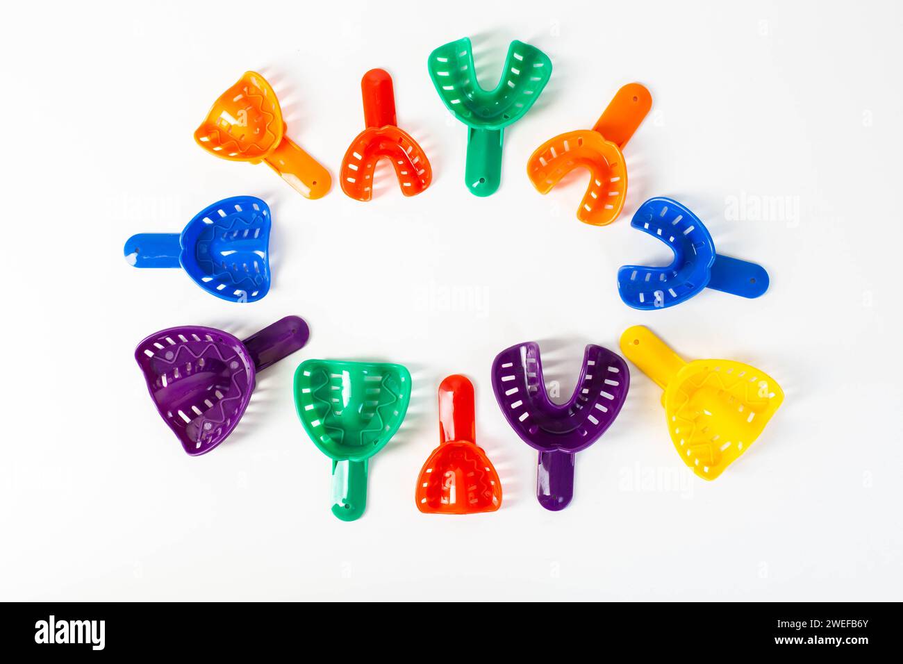 Multi-colored dental spoons for taking an impression of the dental jaw ...