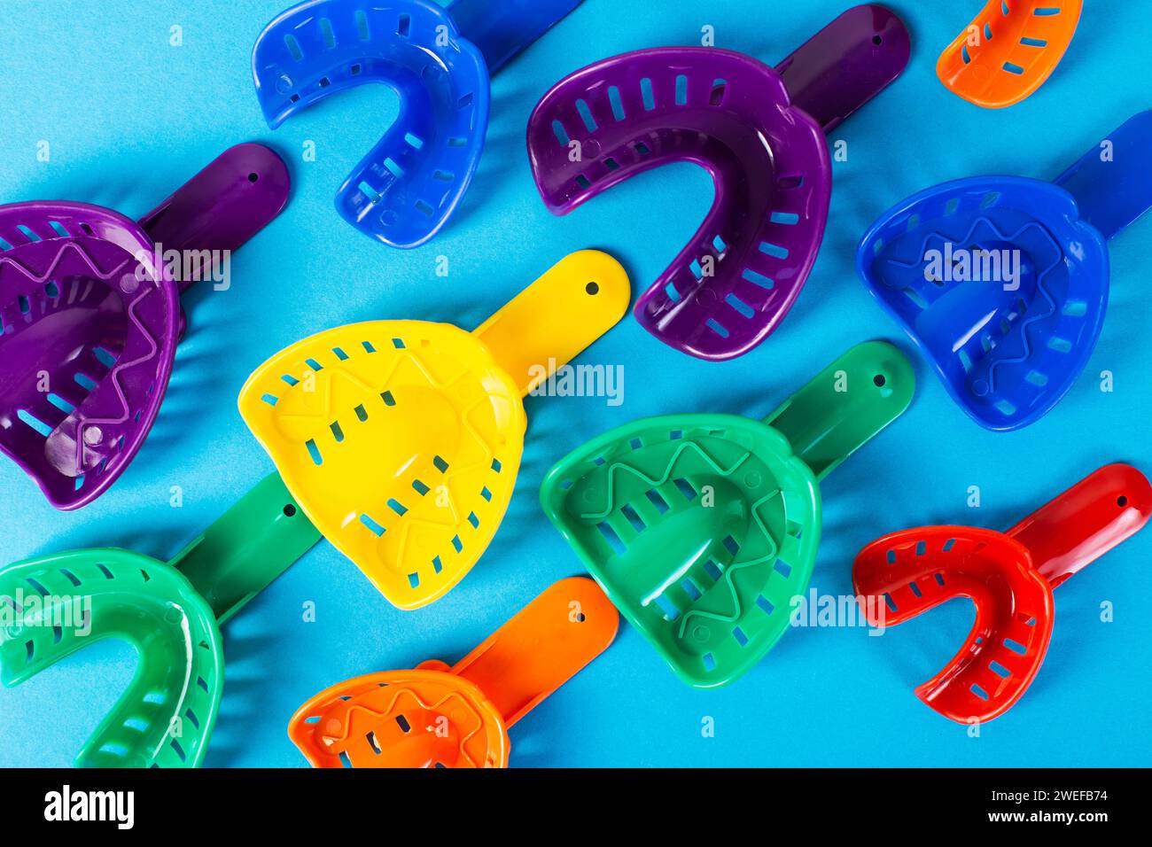 Multi-colored dental spoons for taking an impression of the dental jaw ...