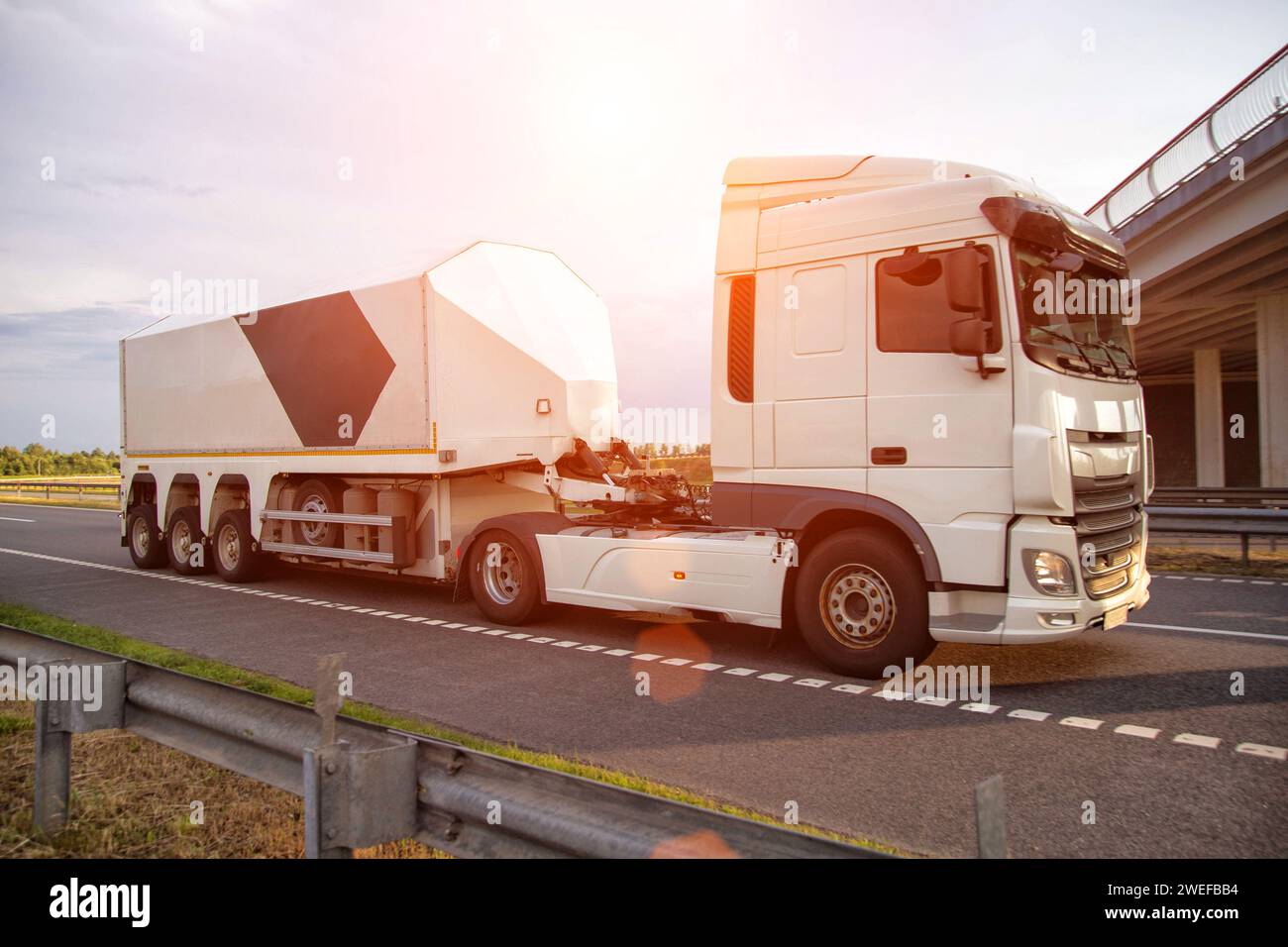 A new modern semi-trailer glass truck transports fragile cargo in the ...
