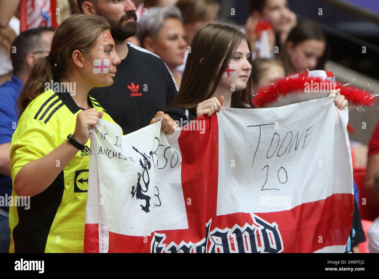 Female fans hold England flag with Russo and Toone names UEFA Women's ...