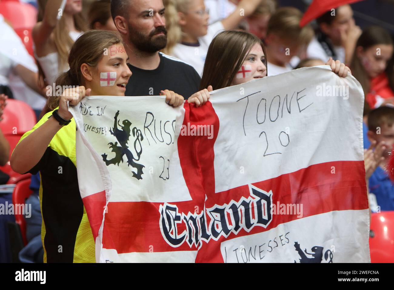 Female fans hold England flag with Russo and Toone names UEFA Women's ...