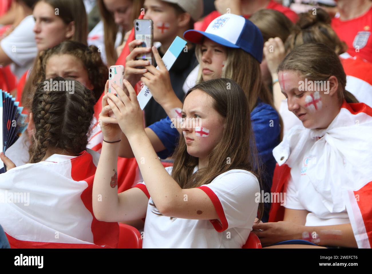 Young female football fan takes a photo with her phone UEFA Women's ...