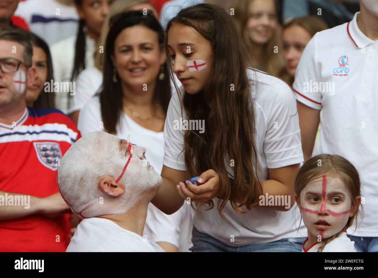 A bald fan has his head painted with St George's cross UEFA Women's ...