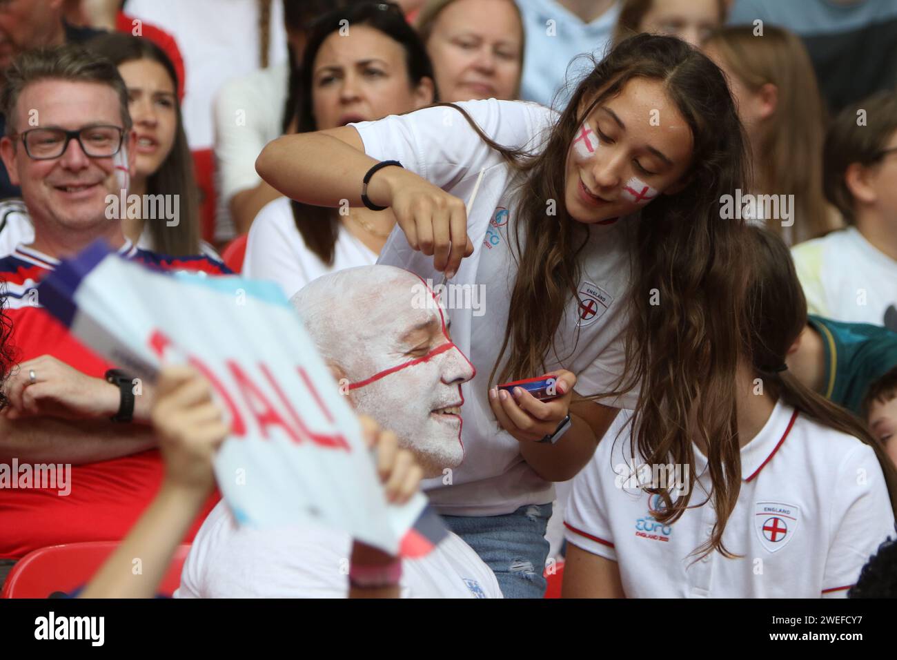 A bald fan has his head painted with St George's cross UEFA Women's ...
