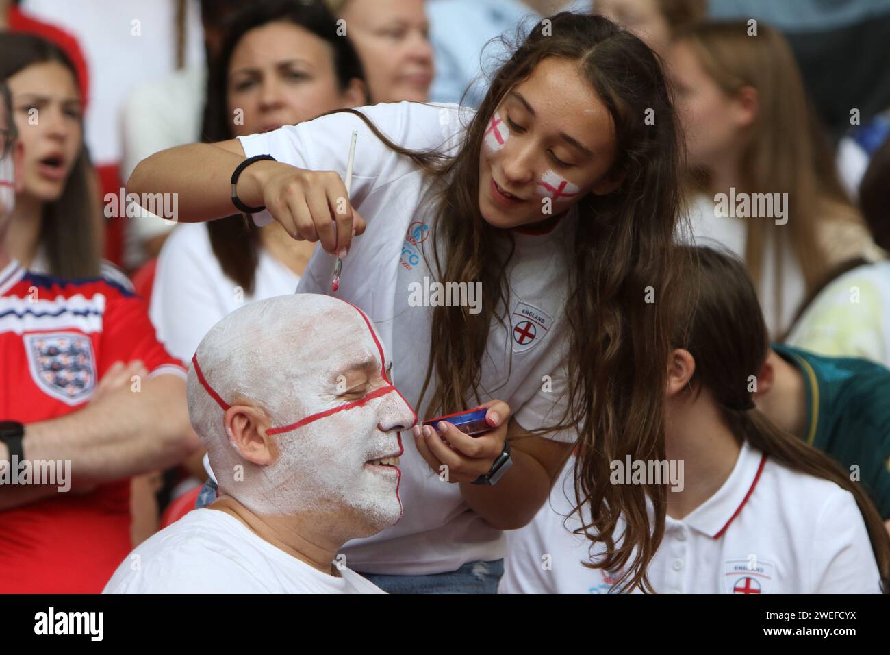 A bald fan has his head painted with St George's cross UEFA Women's ...