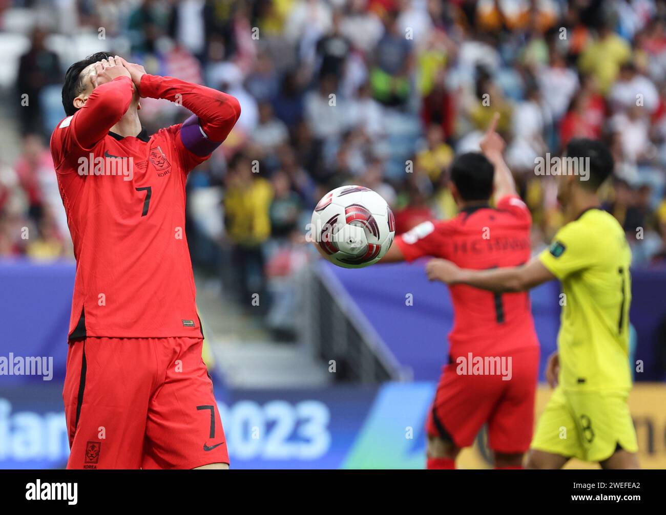 Doha. 25th Jan, 2024. Son Heung Min (L) of South Korea reacts after ...
