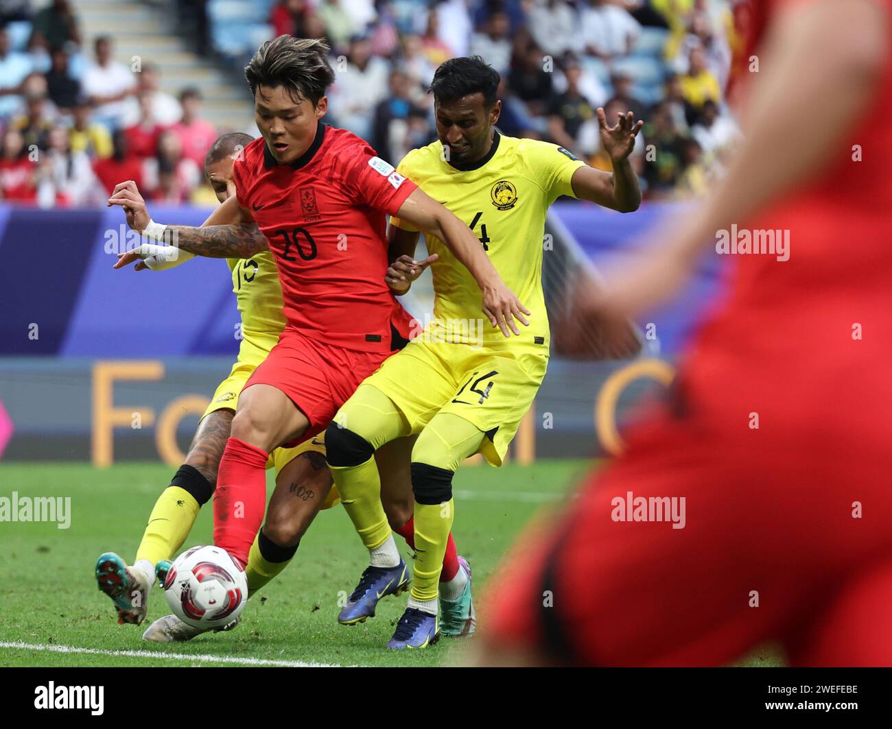 Doha. 25th Jan, 2024. Oh Hyeongyu (2nd L) of South Korea vies during ...