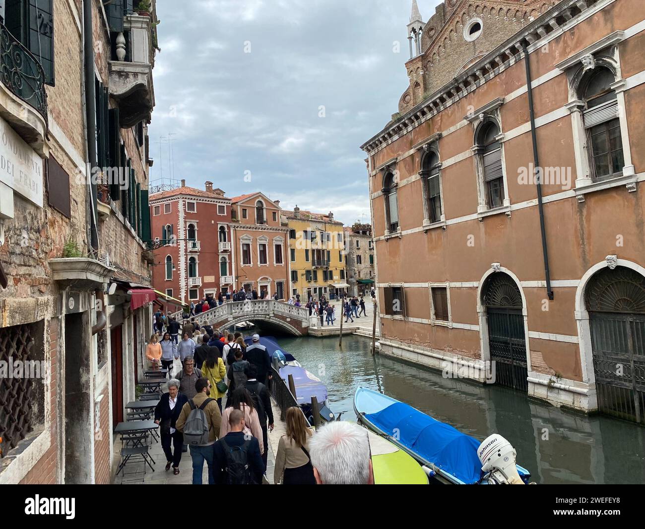 FILED - 19 May 2023, Italy, Venedig: Tourists walk in large groups ...