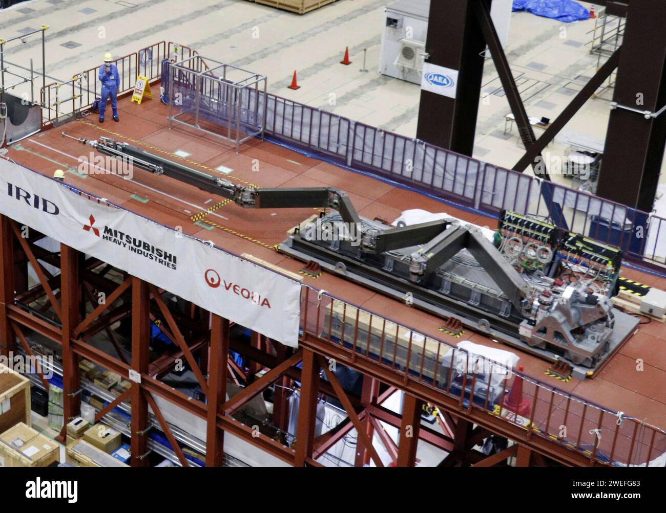 This photo shows a robotic arm designed to remove fuel debris from the ...