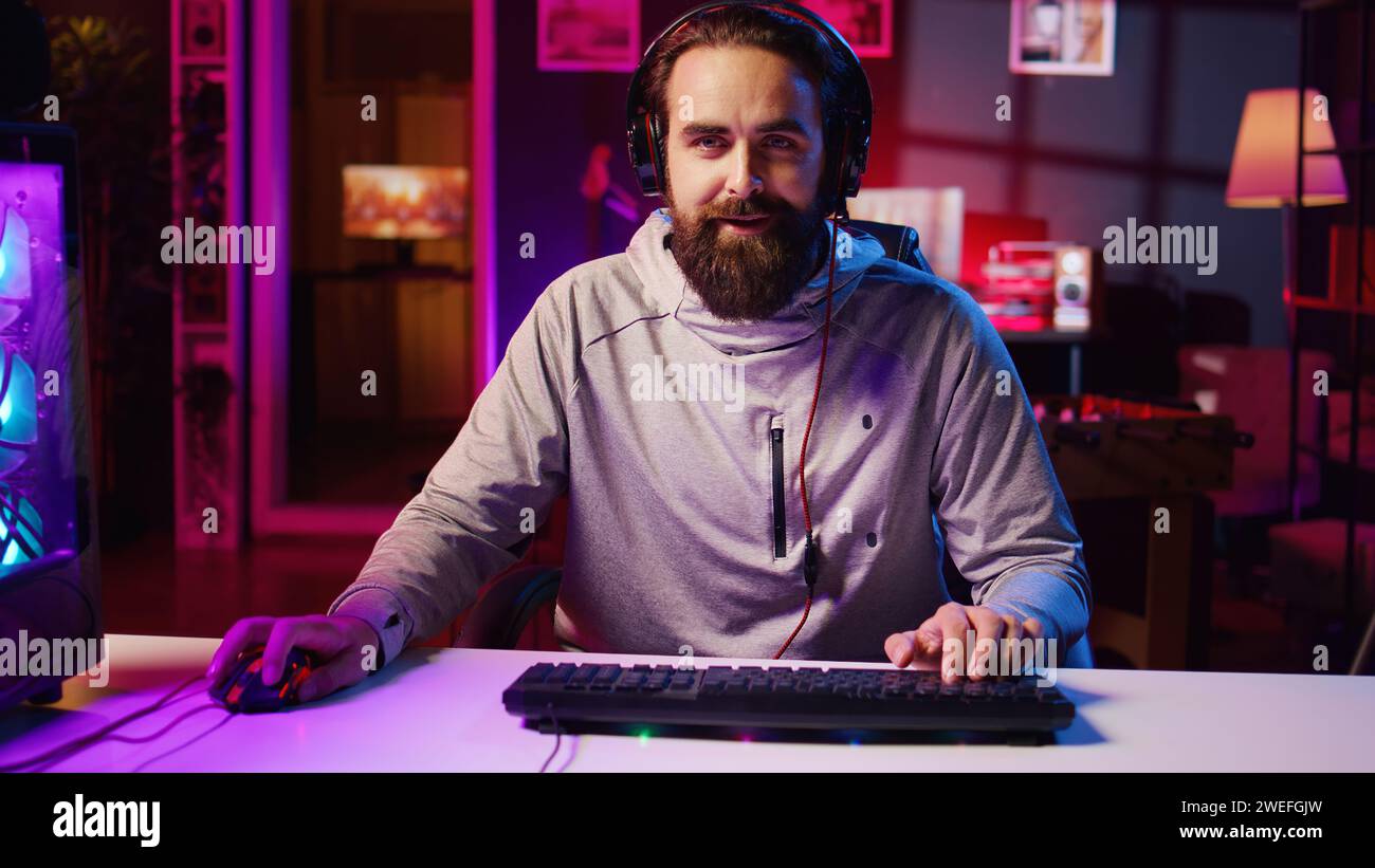 Esports player playing videogames in front of audience during ...