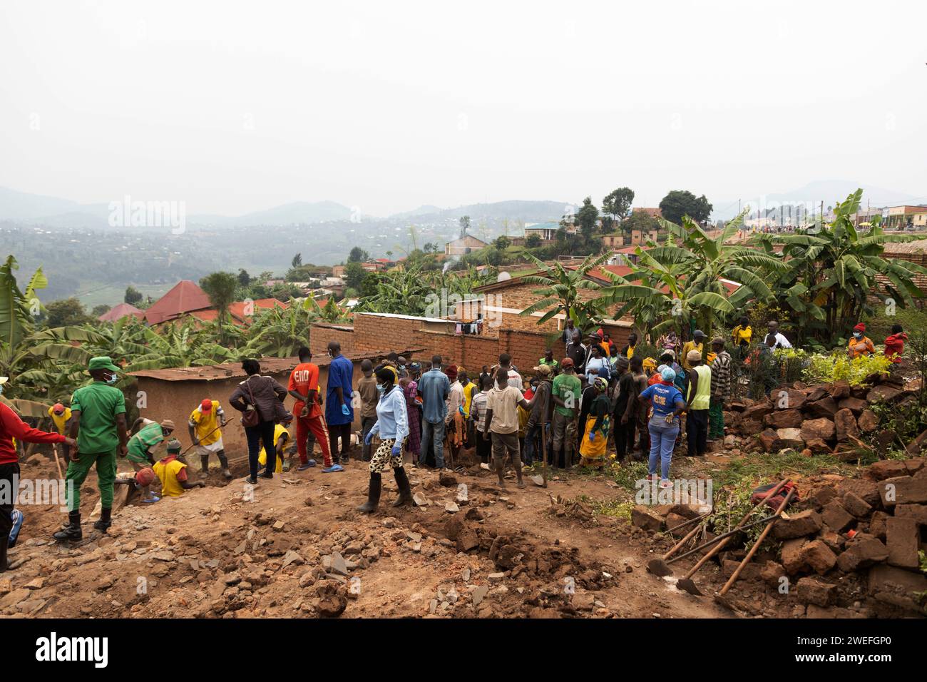 Remains of victims are retrieved from a site, in Huye District ...
