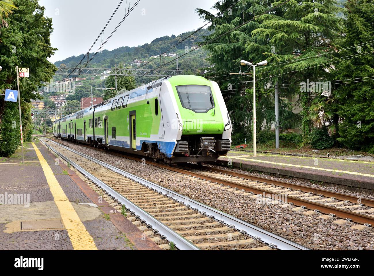 A Trenord class ETR.421 no. 421-034 arrives at Stresa station with a ...