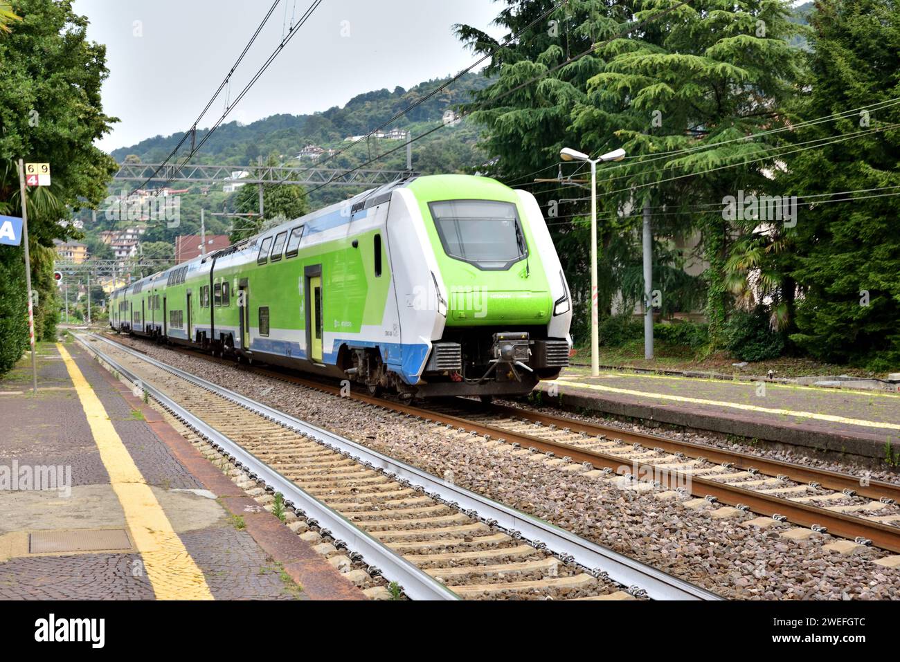 A Trenord class ETR.421 no. 421-034 arrives at Stresa station with a ...