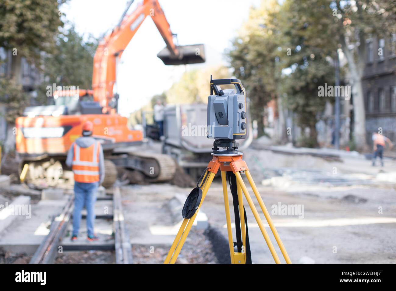 people and machines reconstructing a city street Stock Photo - Alamy