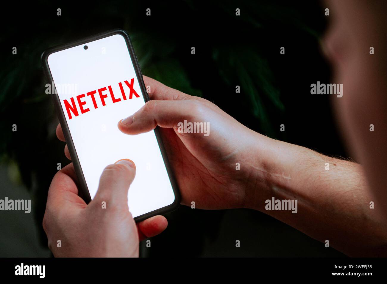 In this photo illustration a Netflix logo seen displayed on a ...
