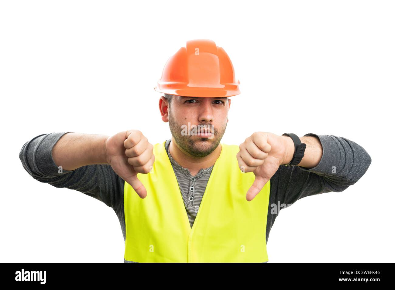 Angry adult constructor man model wearing helmet and fluorescent vest ...