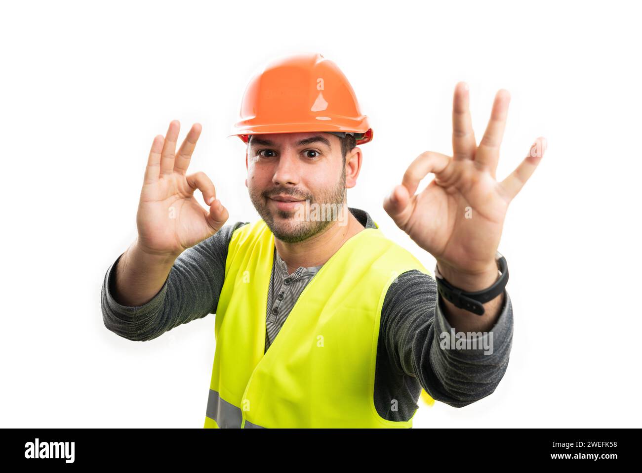 Cheerful builder man with happy friendly expression wearing orange ...