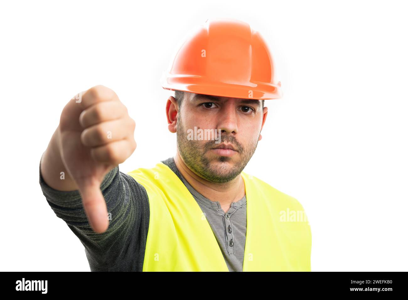Serious builder male model with angry look wearing orange helmet and ...